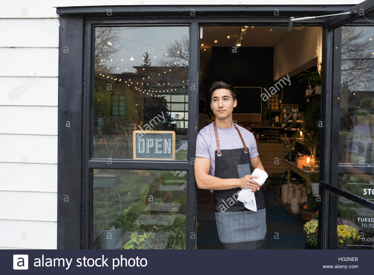 Young man front door towel hi-res stock photography and images - Alamy