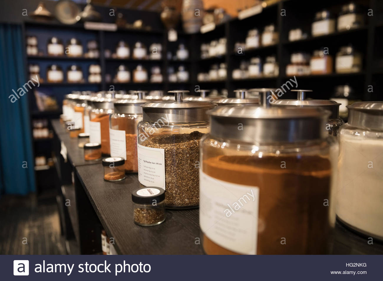 Spices in jars on display in shop Stock Photo - Alamy