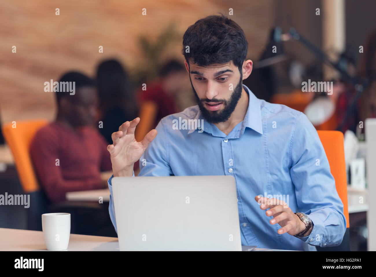 frustrated young business man working on desktop computer Stock Photo ...
