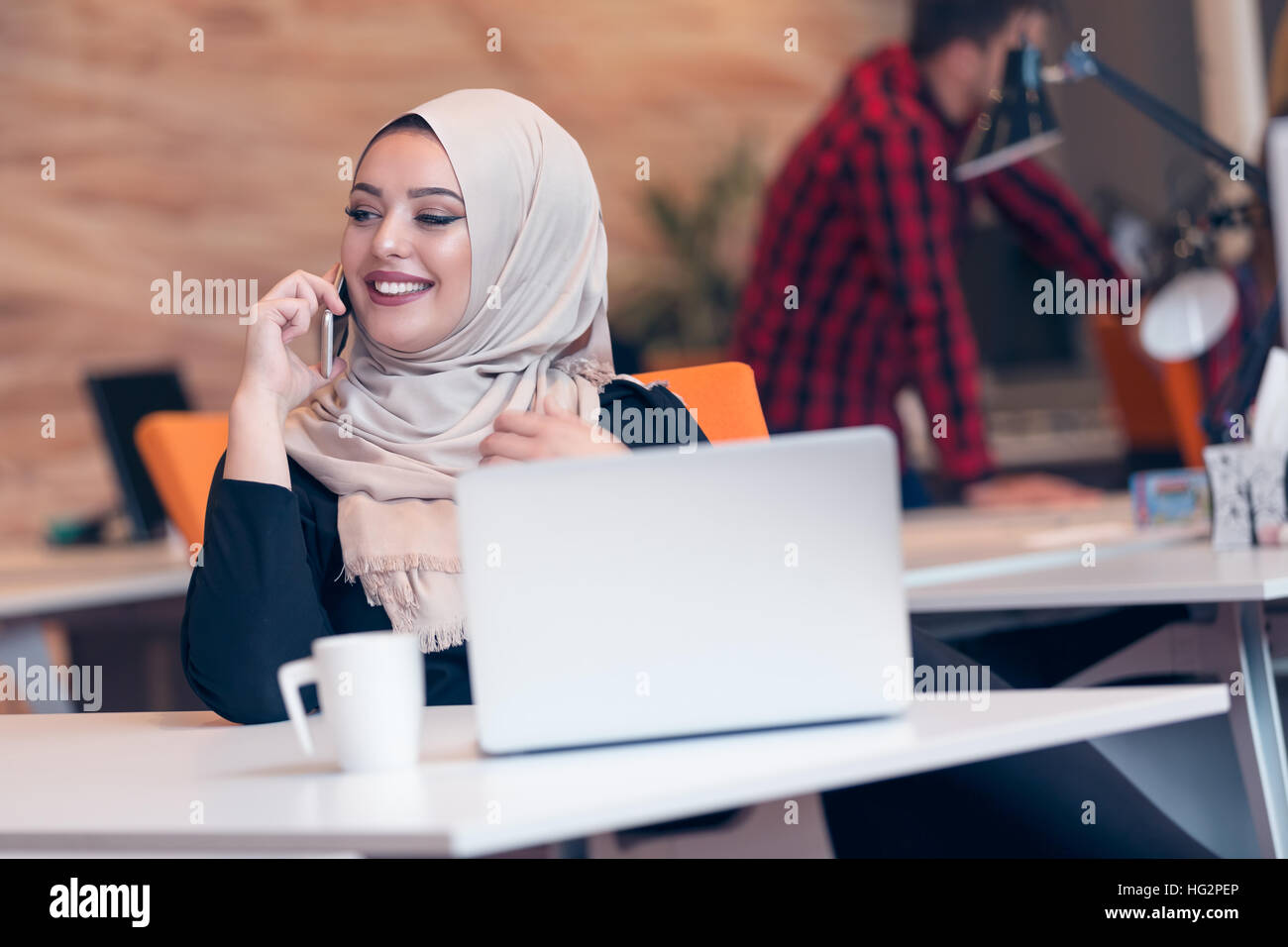 Arabic business woman wearing hijab,working in startup office Stock ...