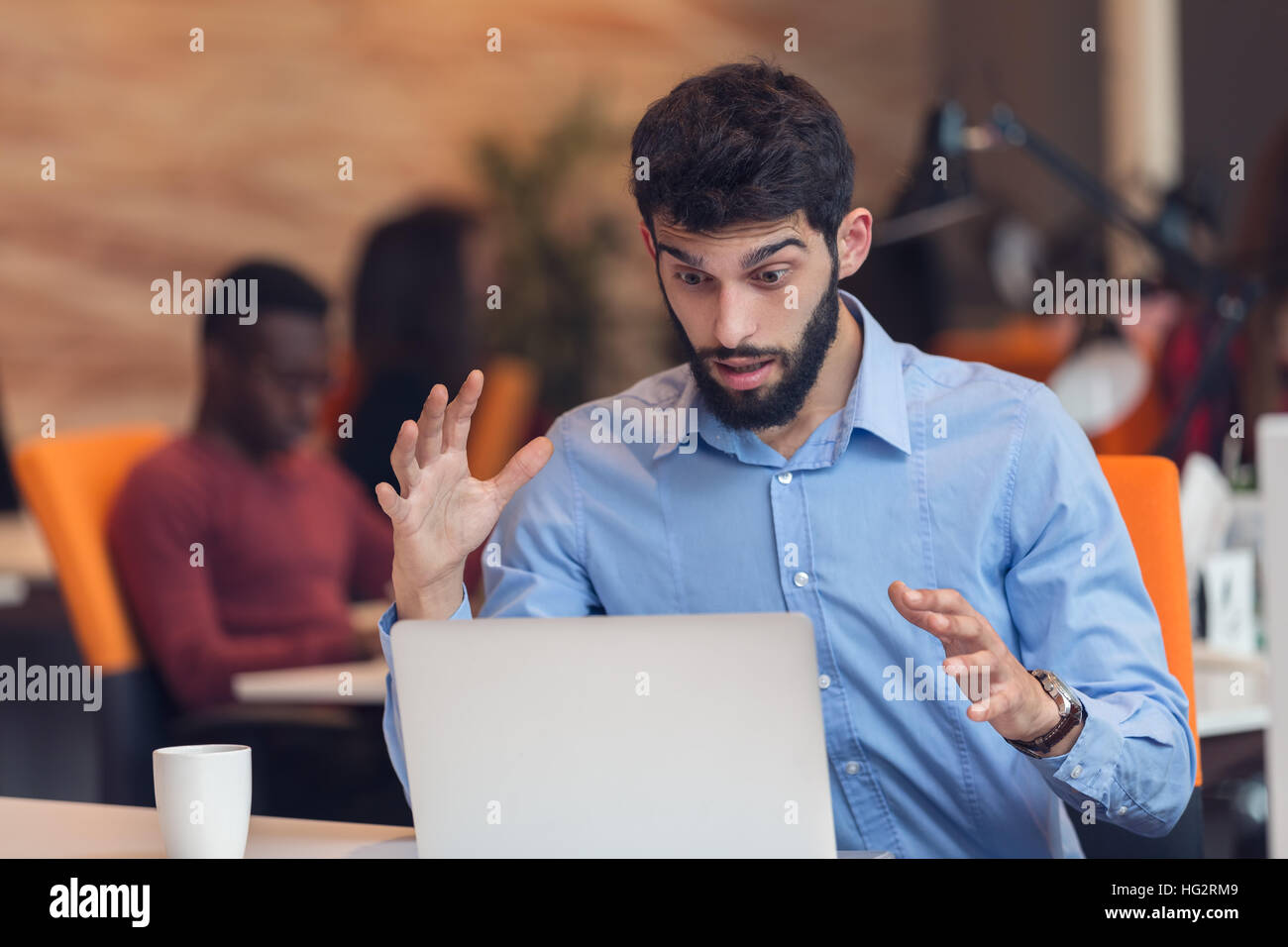 frustrated young business man working on desktop computer Stock Photo ...