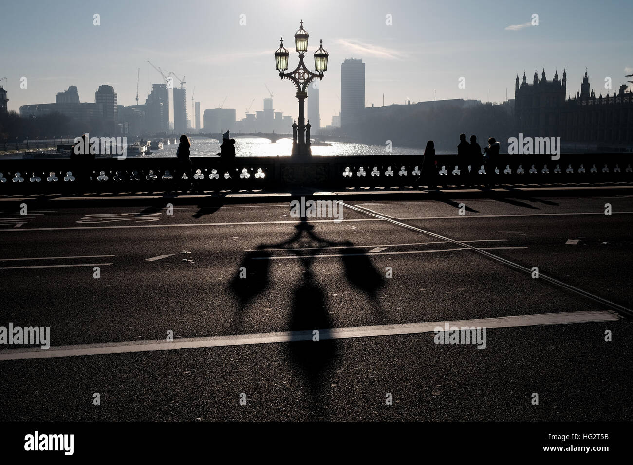 Westminster bridge shadows cast by Victorian ornate lampposts on misty ...