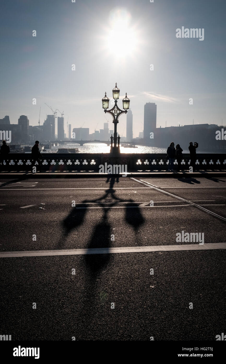 Westminster bridge shadows cast by Victorian ornate lampposts on misty ...
