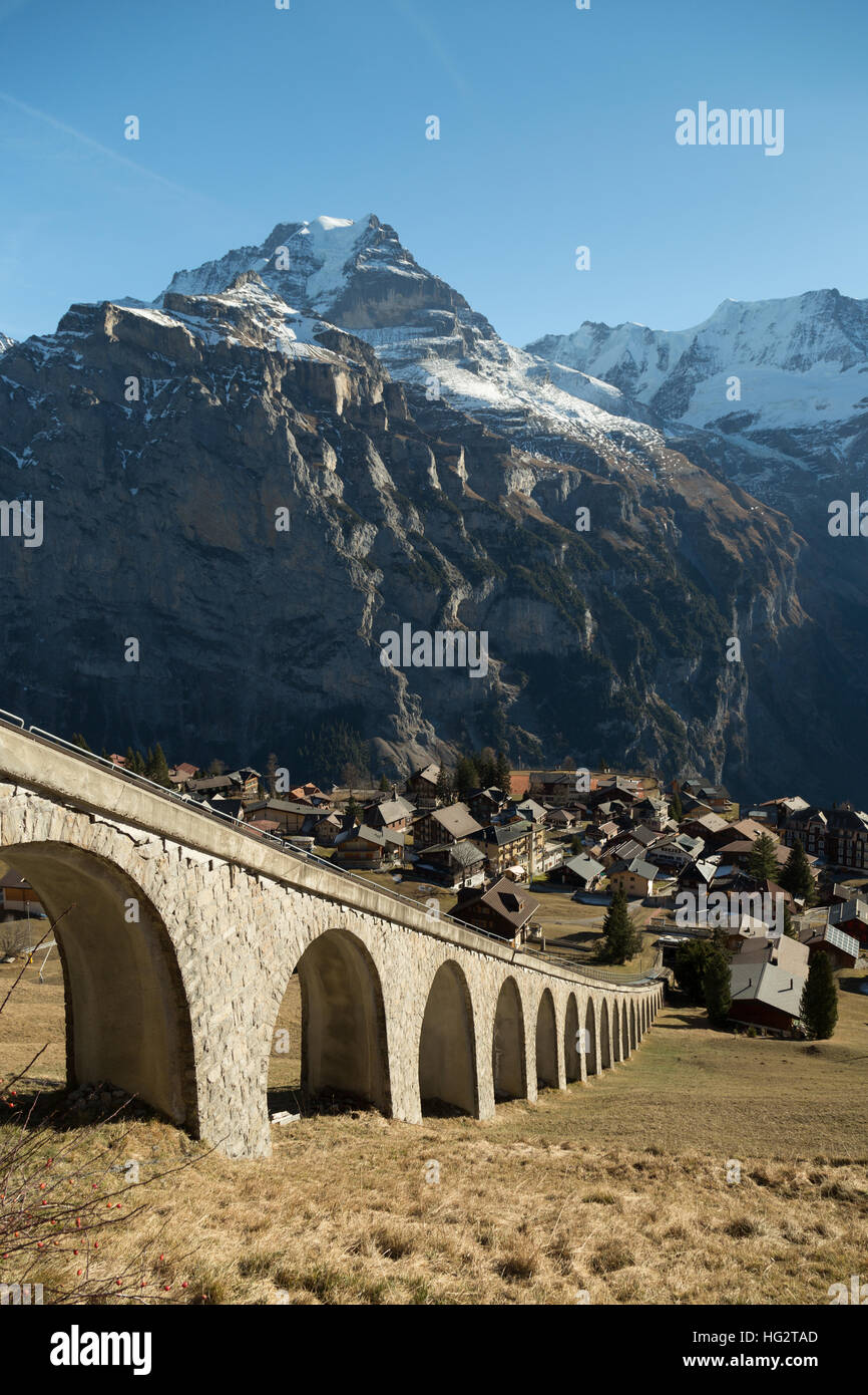 A photograph of a stone arched bridge for a funicular in Mürren on a ...