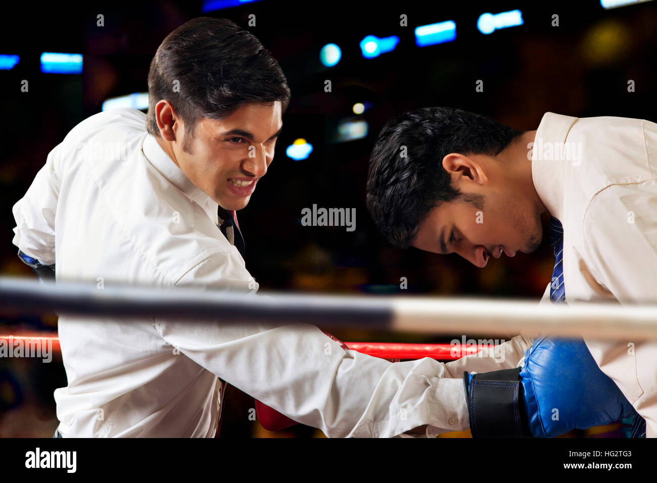 Businessmen fighting in boxing ring Stock Photo - Alamy