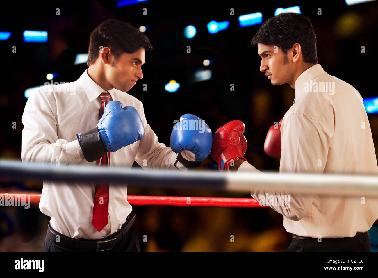 Businessmen fighting in boxing ring Stock Photo - Alamy