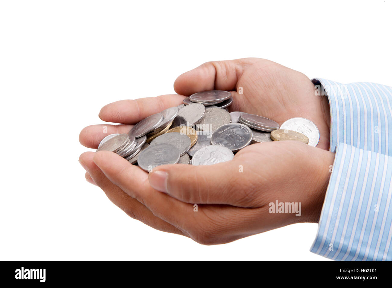 Handful of coins in palm hands isolated on white Stock Photo - Alamy