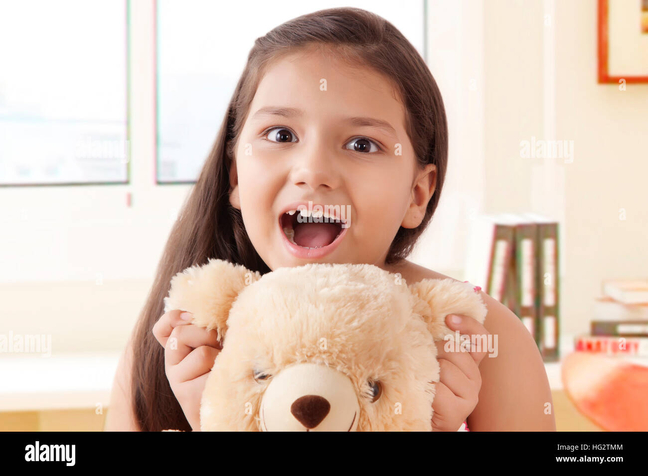 Portrait of smiling girl holding teddy bear Stock Photo - Alamy Portrait of smiling girl holding teddy bear Stock Photo - Alamy