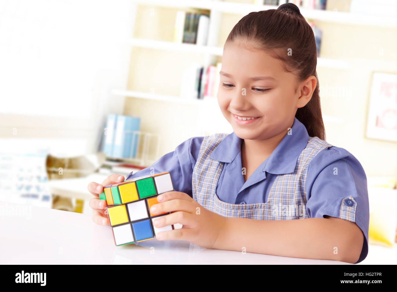 Girl with rubiks cube hi-res stock photography and images - Alamy