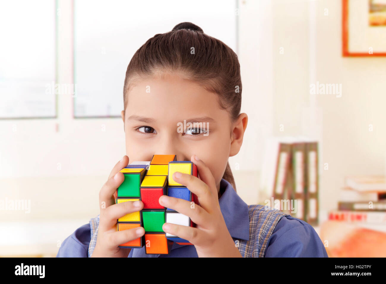 Girl with rubiks cube hi-res stock photography and images - Alamy