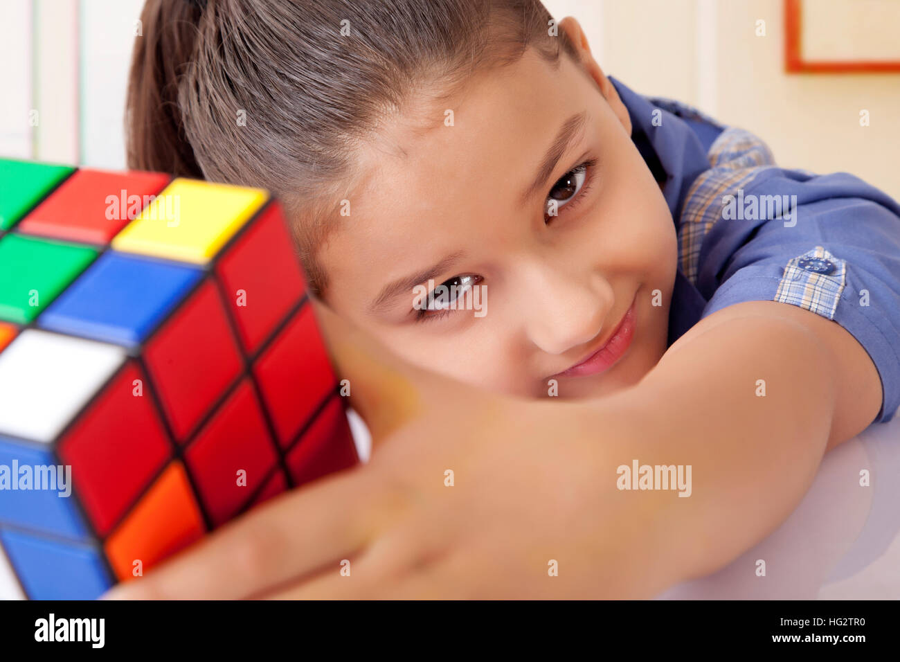 Girl with rubiks cube hi-res stock photography and images - Alamy