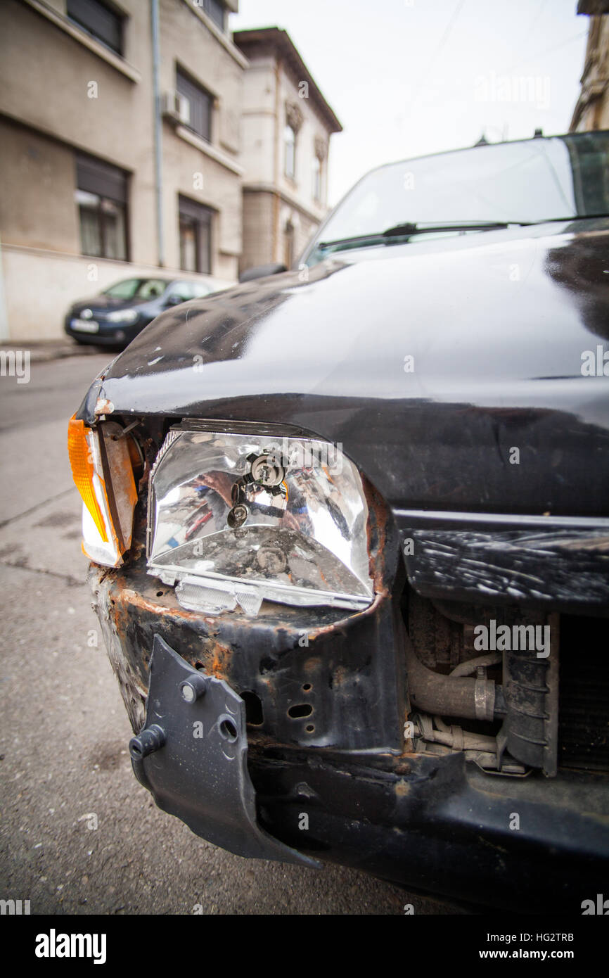 Color image of a crashed car with broken headlight Stock Photo - Alamy