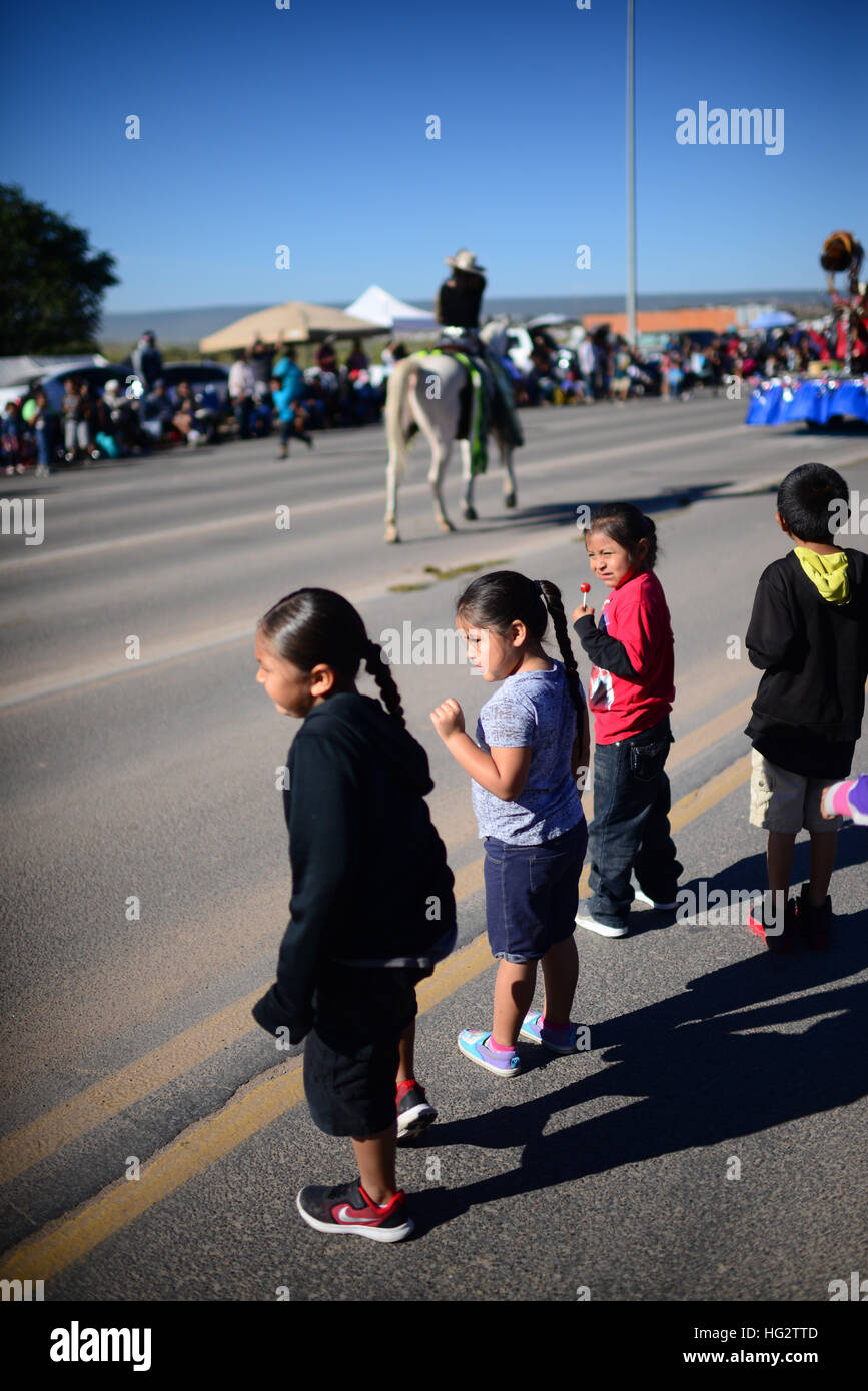 Kids wait and catch candies during morning parade at Navajo Nation Fair ...