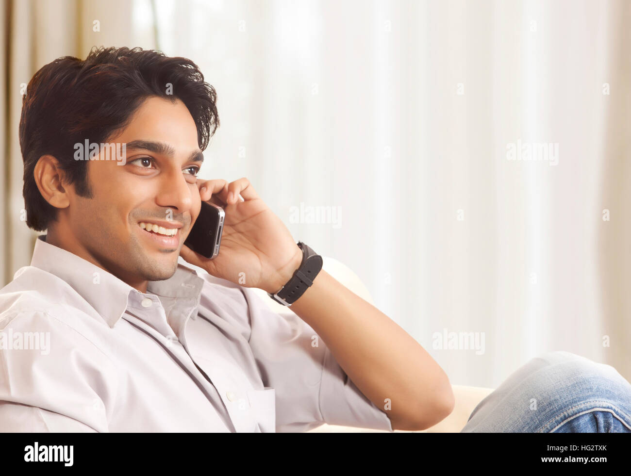 Mobile sitting hi-res stock photography and images - Alamy