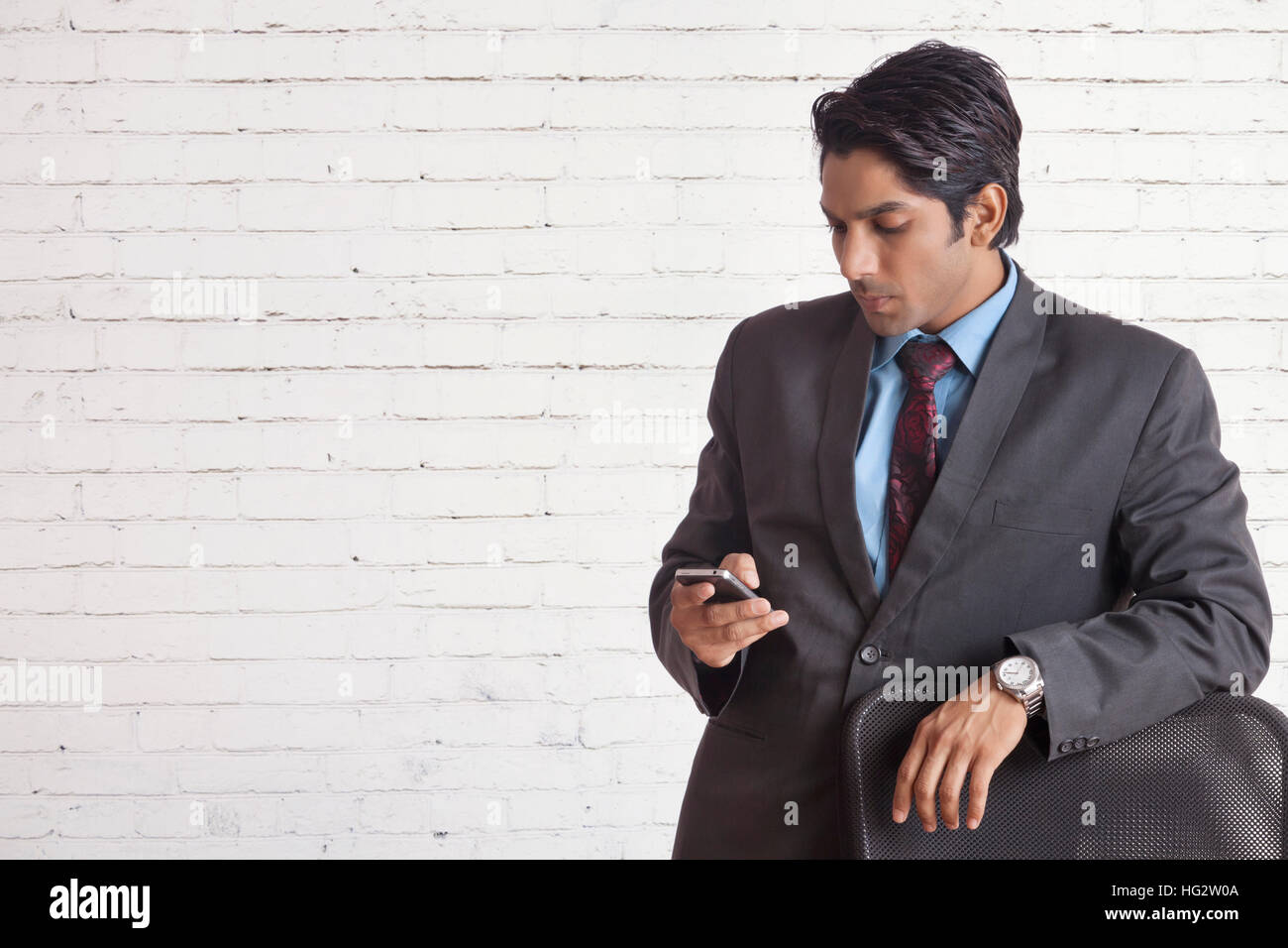Executive using cell phone Stock Photo - Alamy