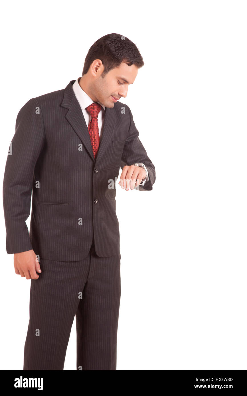 businessman looking at his watch against white background Stock Photo ...