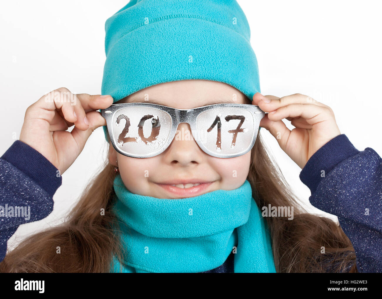 Girl in a cap and scarf in funny glasses with the inscription "2017 ...