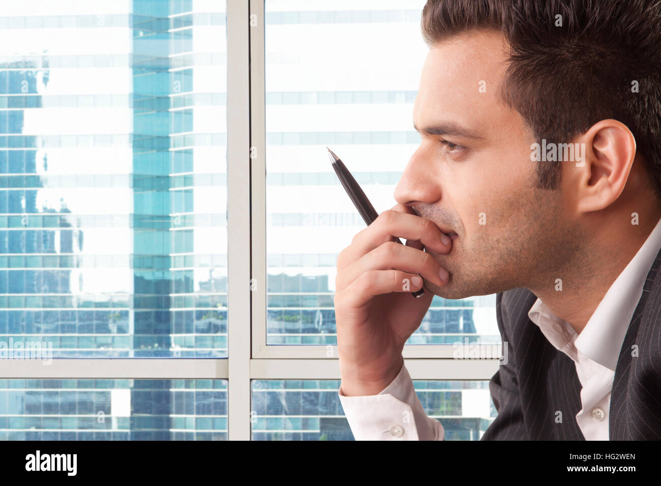 Portrait of a businessman thinking Stock Photo - Alamy