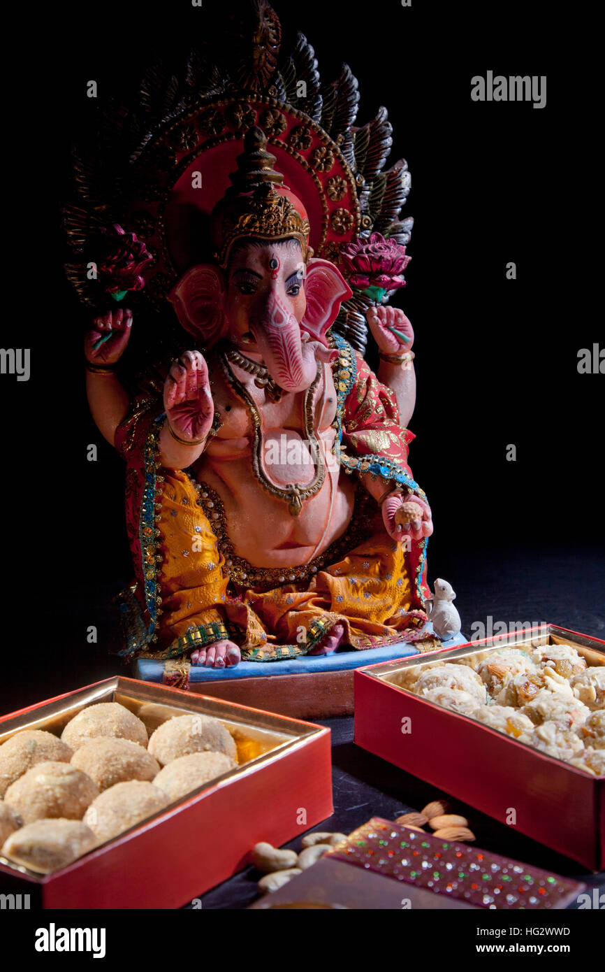 Sculpture of Ganesha with sweets , indian sweet Stock Photo - Alamy