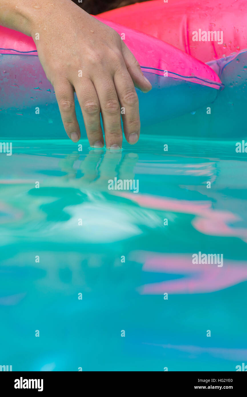 Hand On Floating Pool Raft Stock Photo - Alamy