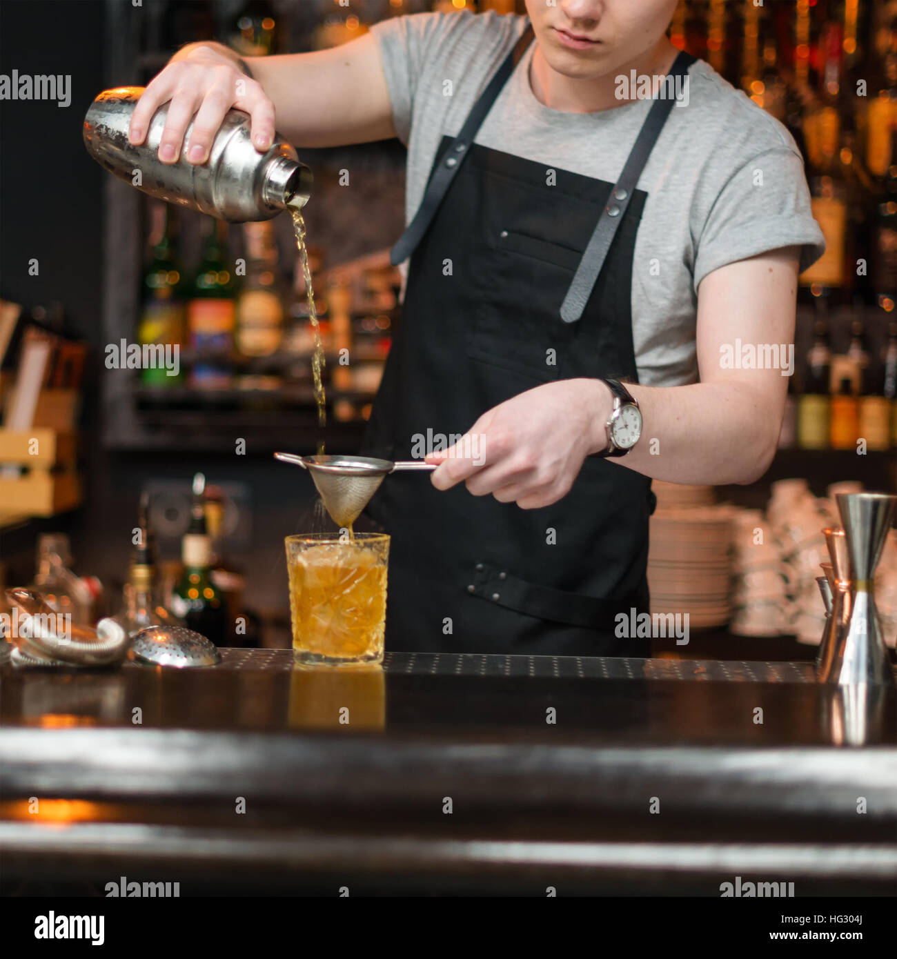 Barman show. Bartender is making cocktail at night club Stock Photo - Alamy