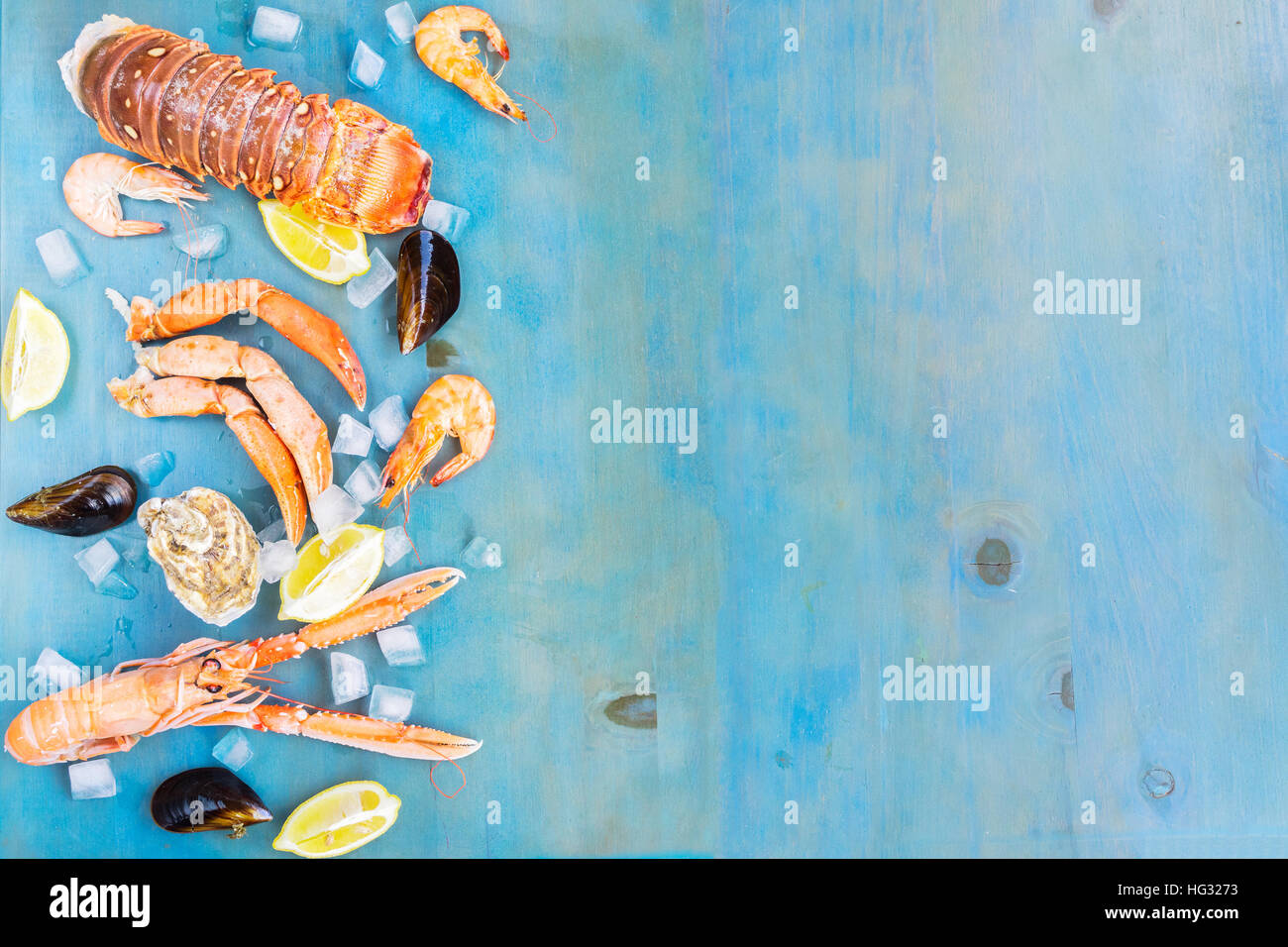 Fresh seafood on blue background Stock Photo - Alamy