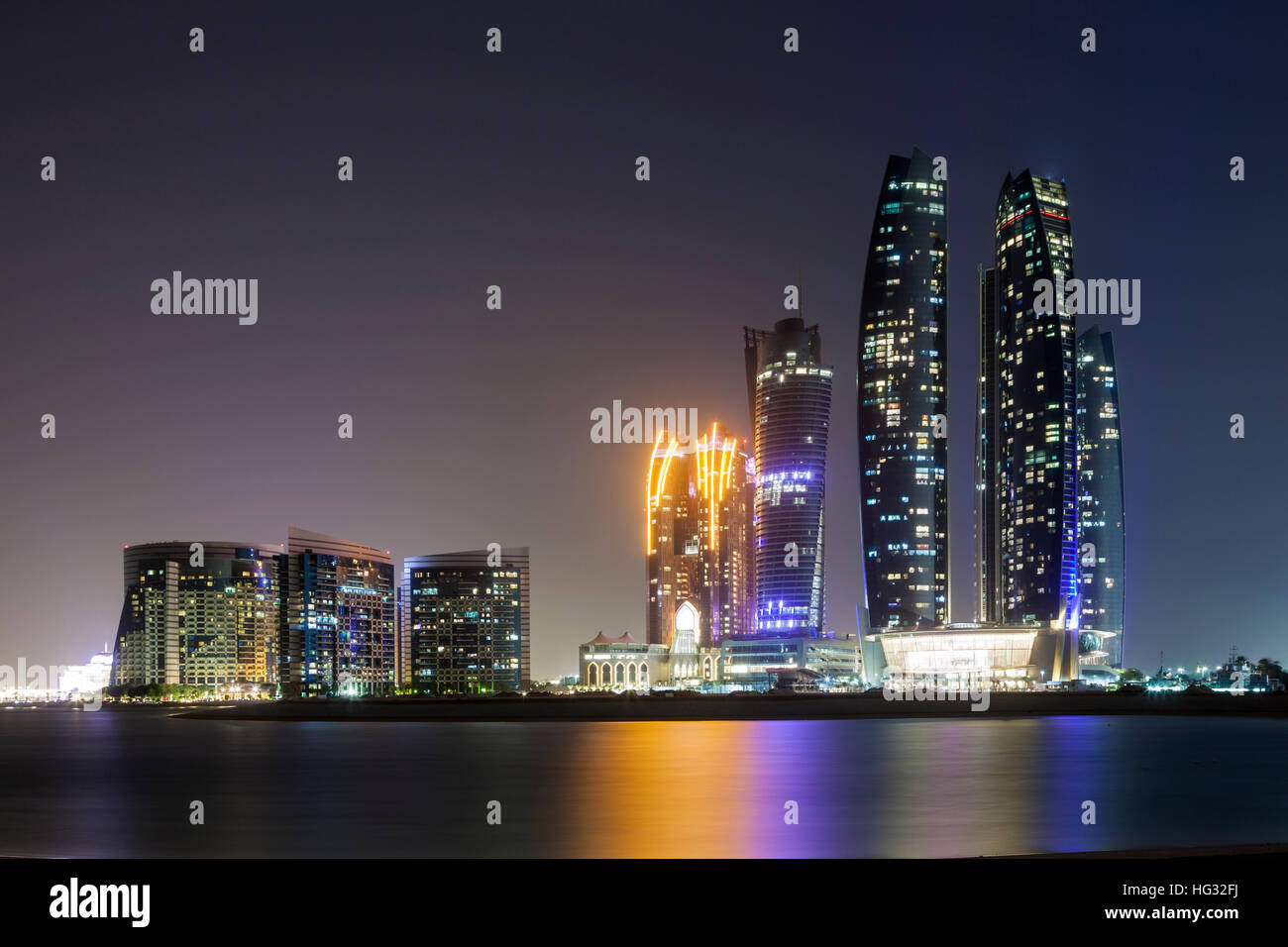 The Etihad Towers in Abu Dhabi illuminated at night Stock Photo - Alamy