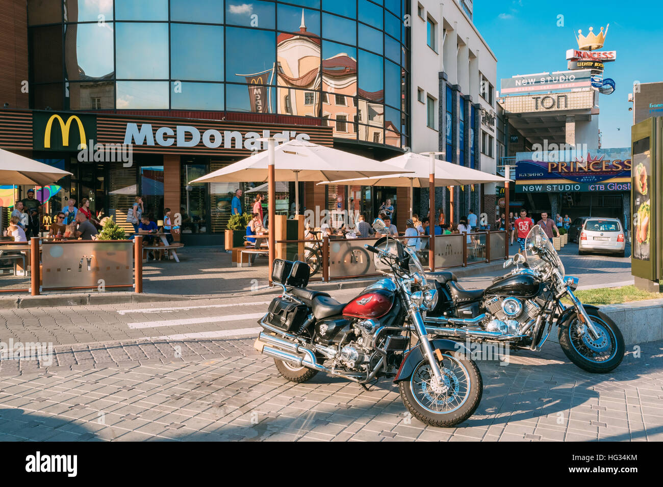 Minsk, Belarus. Two New Chopper Style Motorcycles, Parked Near Crowded ...