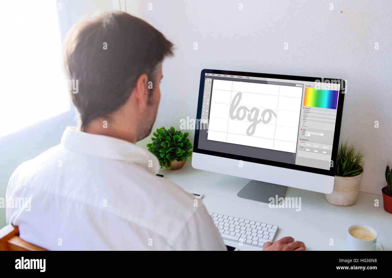 graphic designer designing a logo on computer. All screen graphics are ...