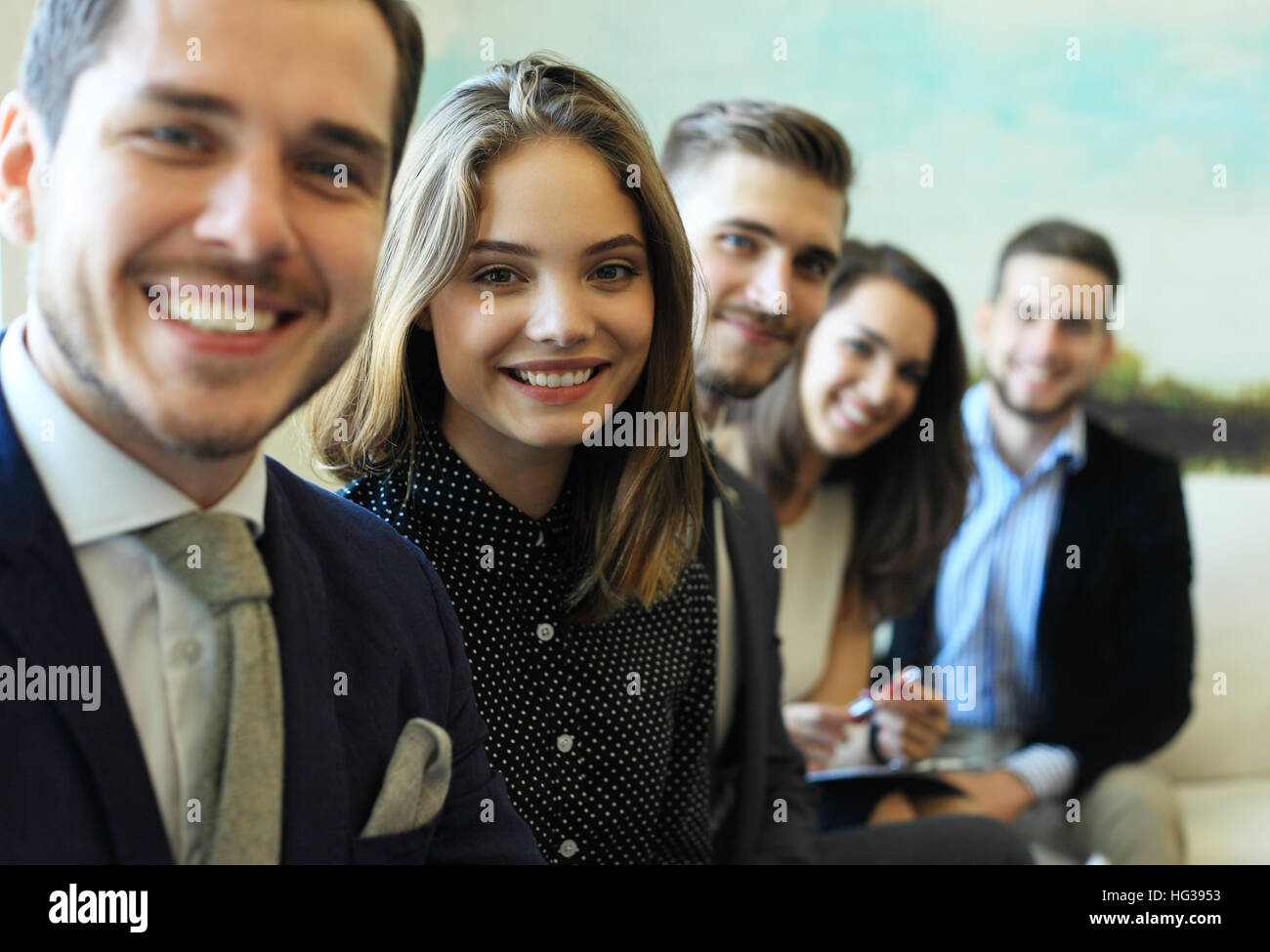 Smiling employee's in a line at work Stock Photo - Alamy