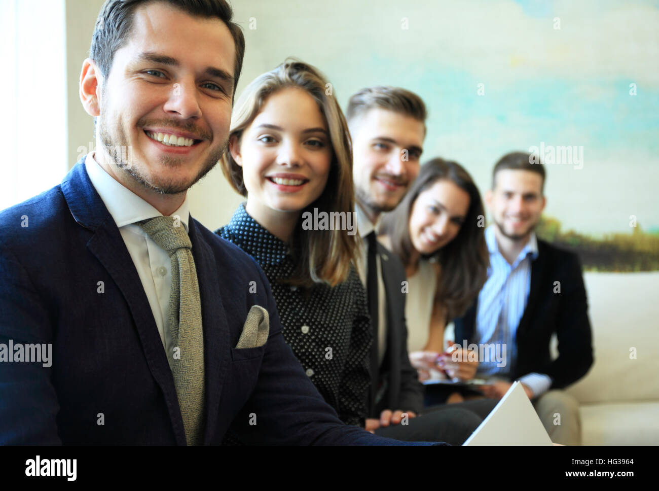 Smiling employee's in a line at work Stock Photo - Alamy