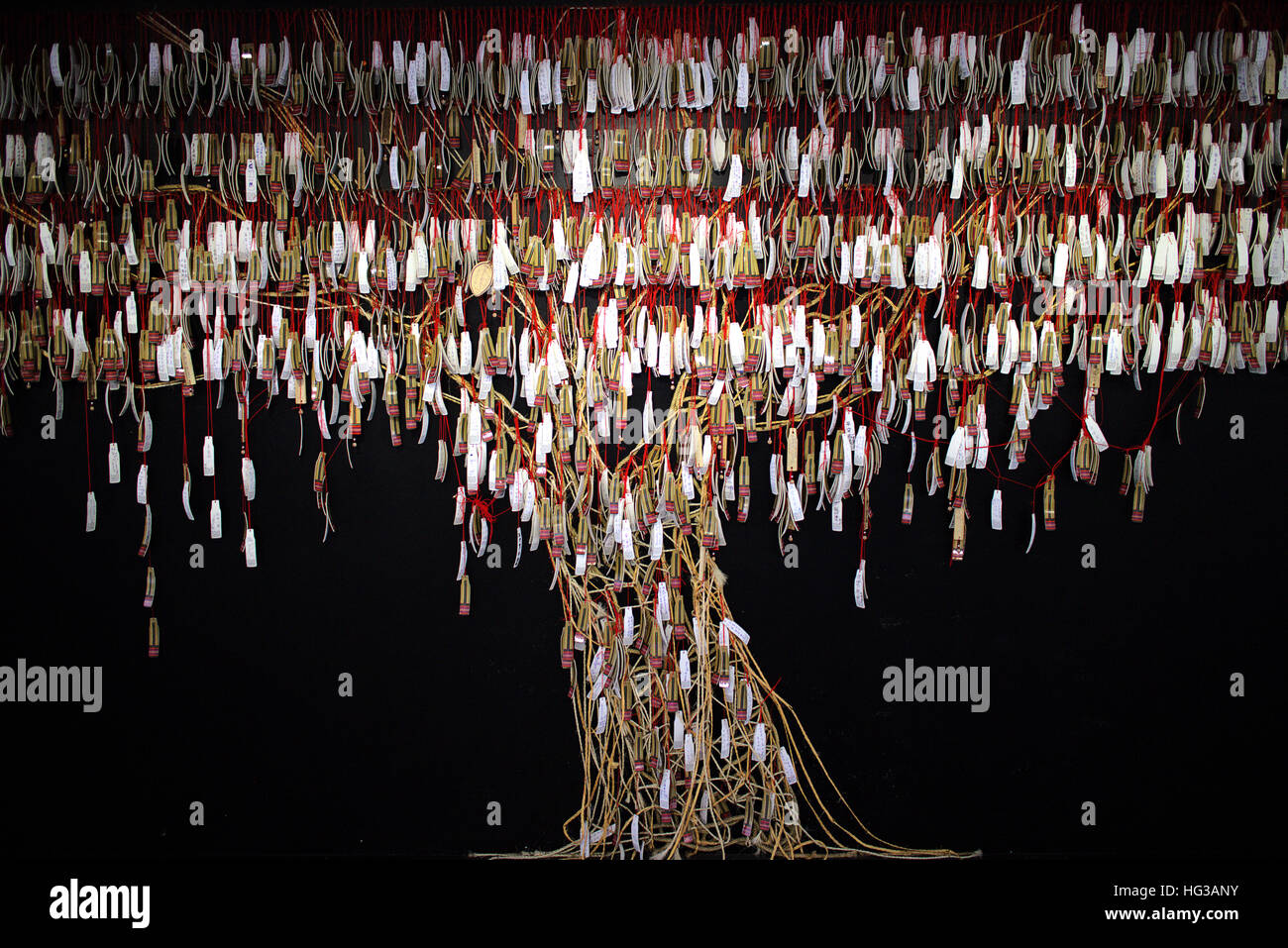 omikuji - Buddhist papers tied in taiwan Stock Photo - Alamy