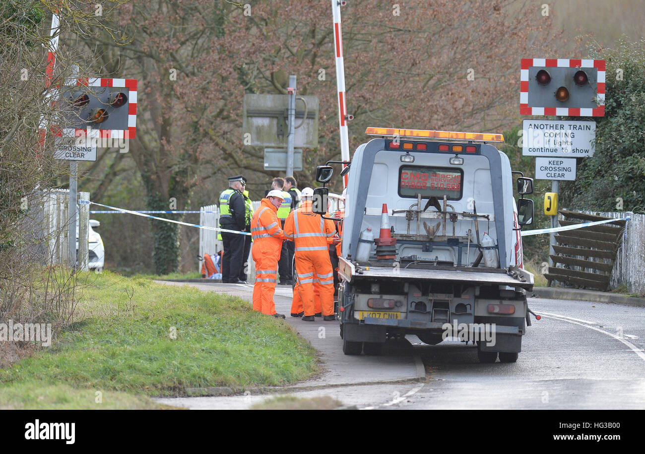 Police and Network Rail staff at the scene of a crash where a driver ...