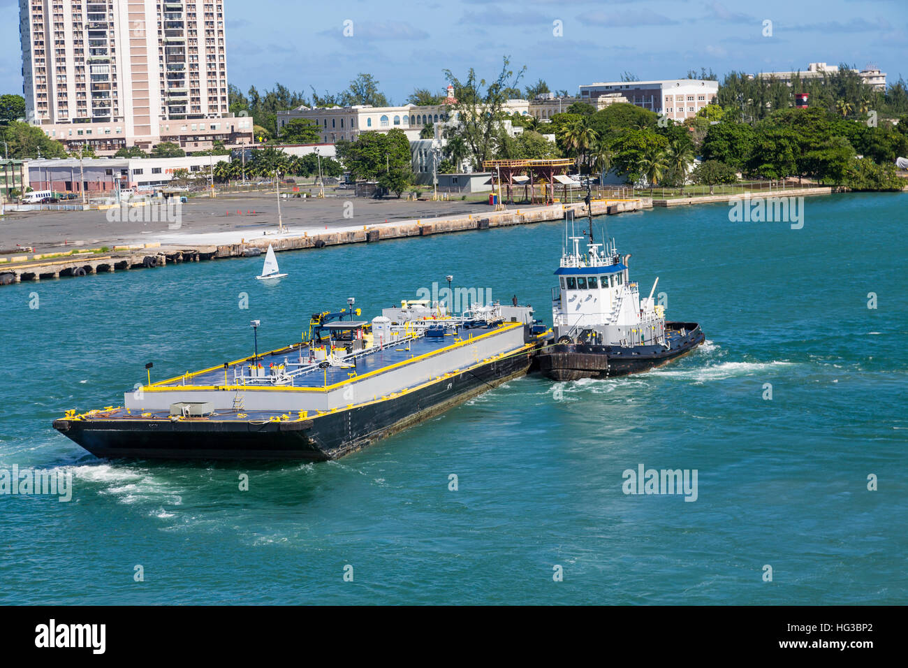 A tugboat pushing a fuel barge in Puerto Rico Stock Photo - Alamy
