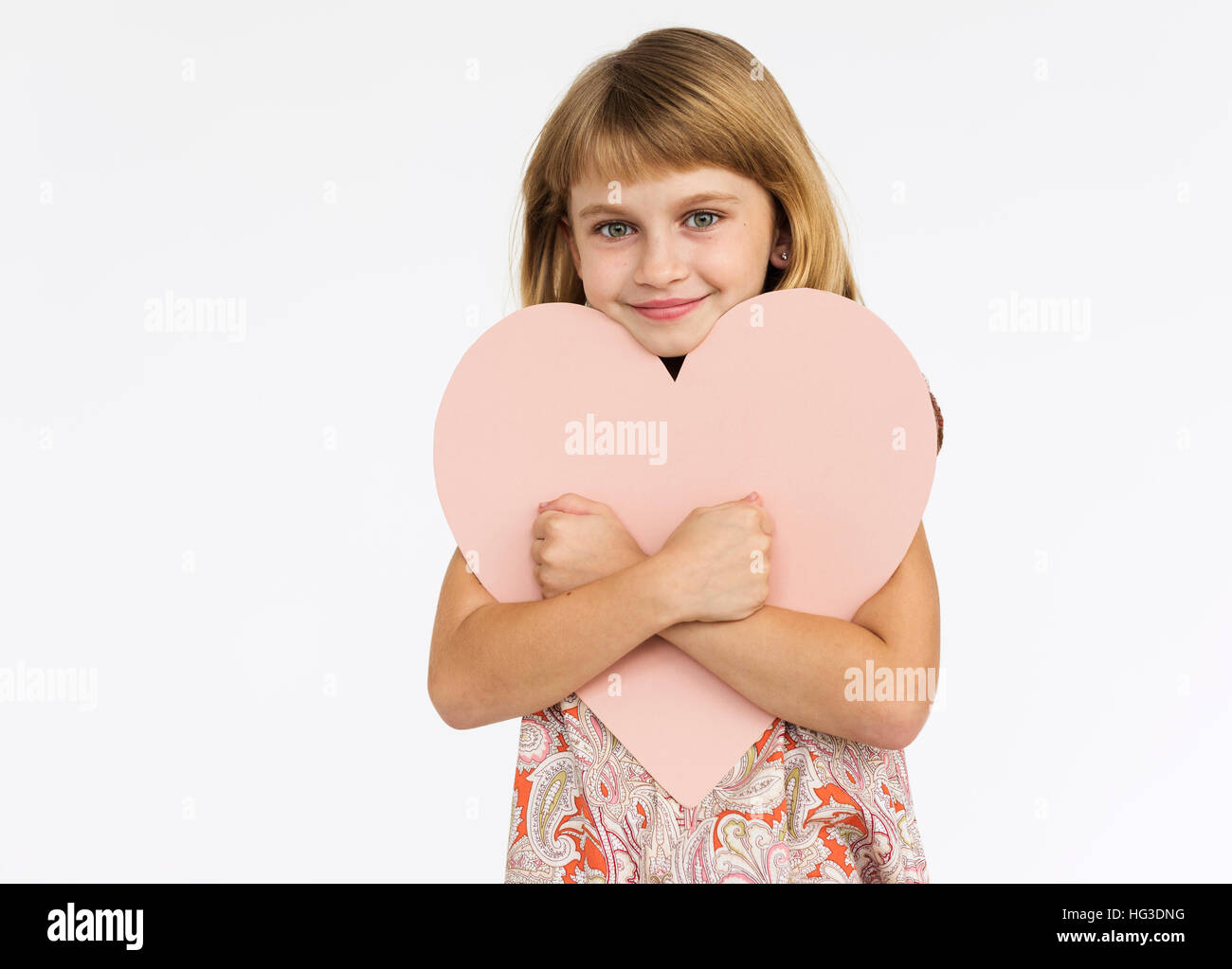 Cheerful Little Girl Hugs Heart Concept Stock Photo - Alamy
