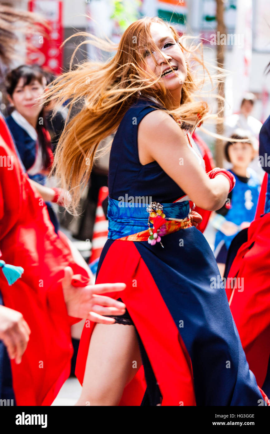 Yosakoi festival. Japanese women dancer with dyed red hair, dancing in ...