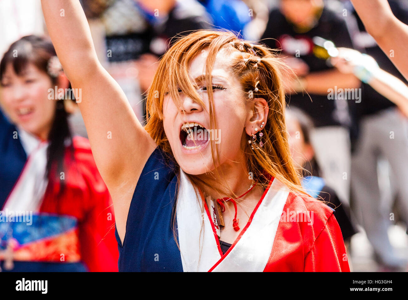 Yosakoi festival. Japanese women dancer with dyed red hair, dancing in ...