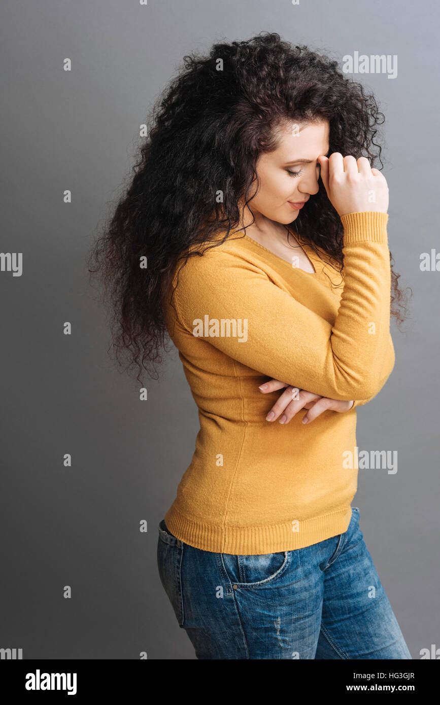 Attractive upset female tilting her head Stock Photo - Alamy