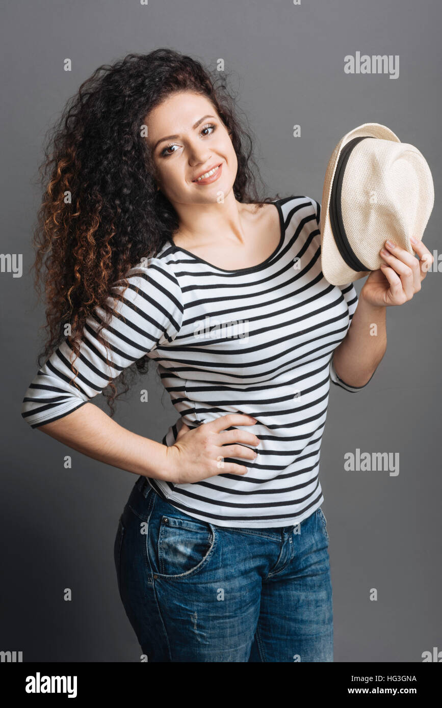 Crummy girl standing over grey background Stock Photo - Alamy