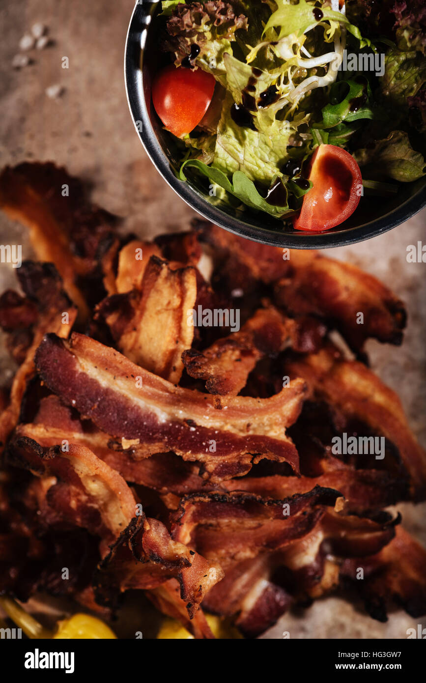 Top view of fried bacon and salad standing on table Stock Photo - Alamy