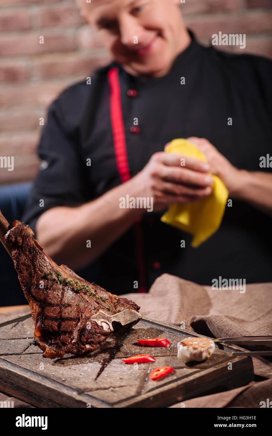 Close up of smiling man posing with steak in restaurant Stock Photo - Alamy
