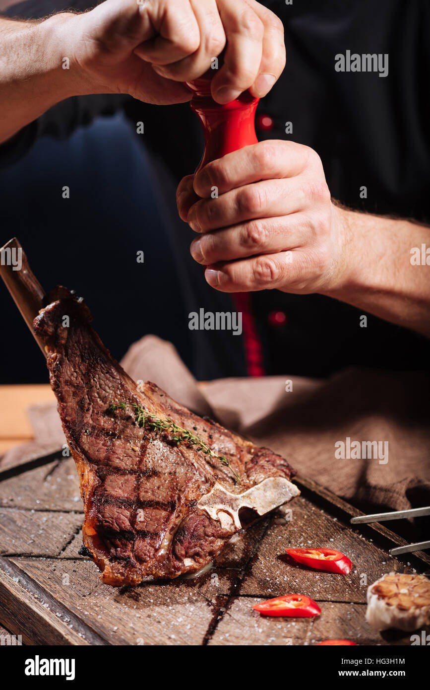 Close up man salting meat hi-res stock photography and images - Alamy