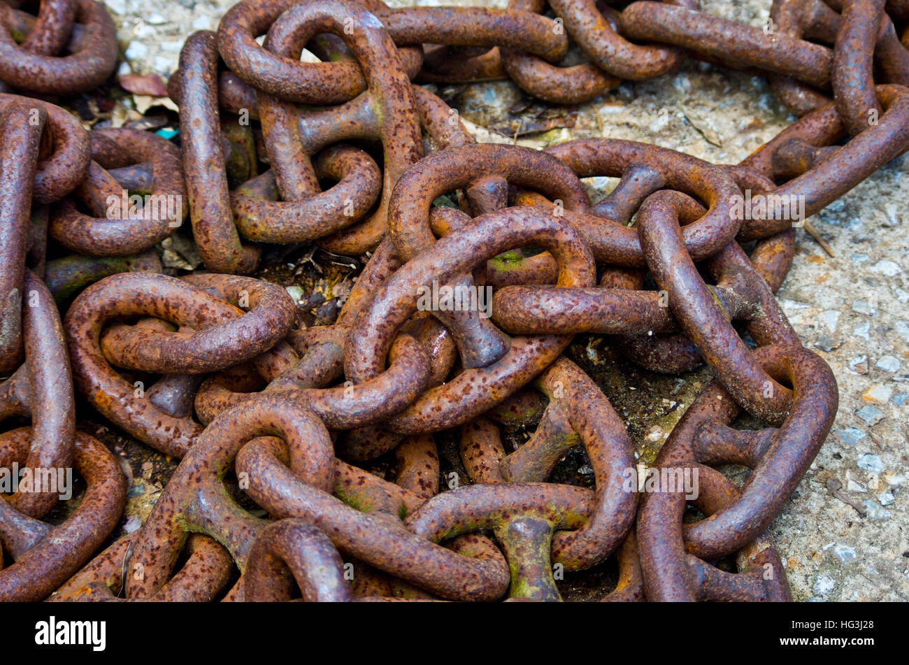 old rusty iron chains, knotted and worn from use Stock Photo - Alamy