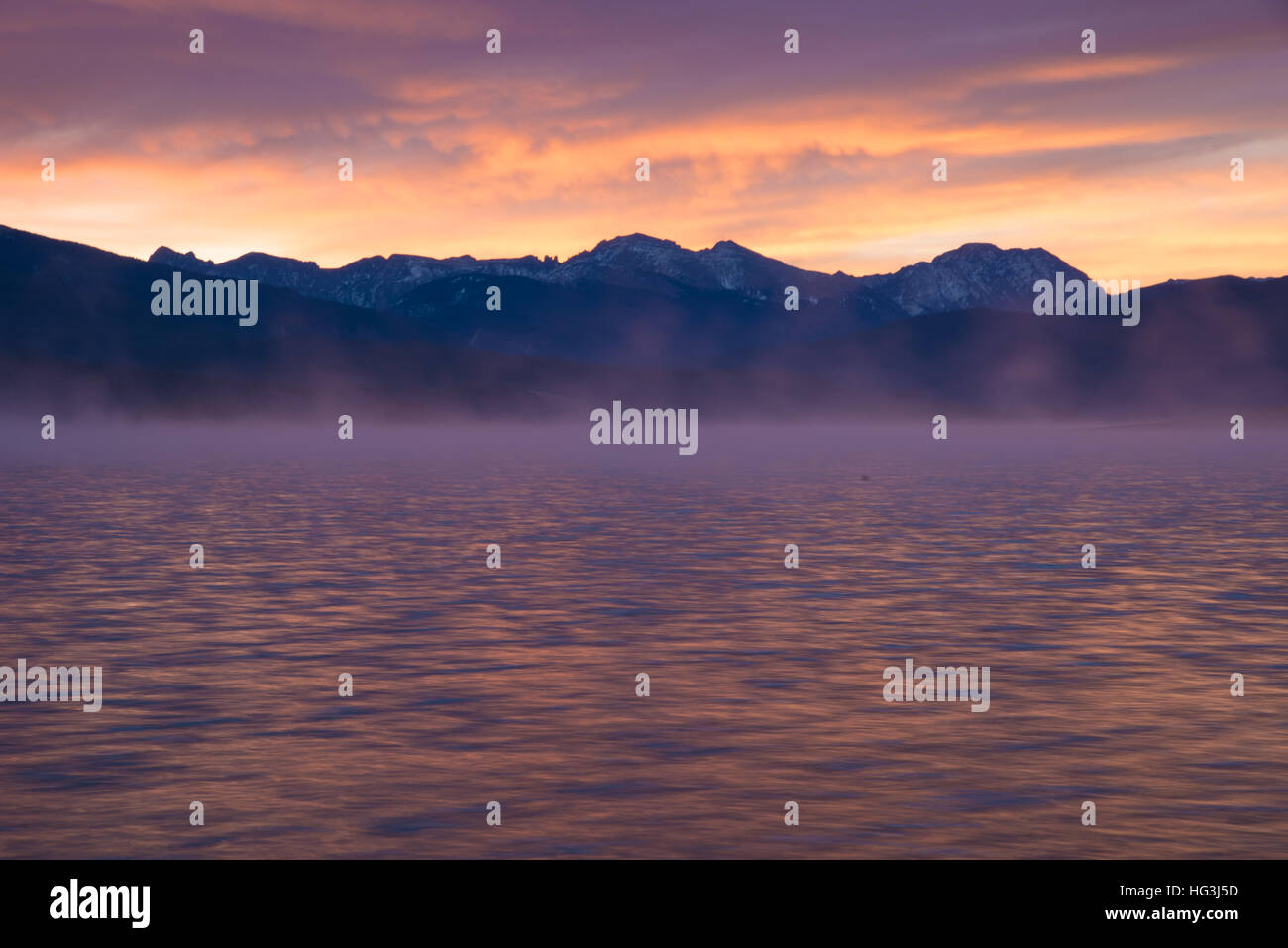 Sun rising behind Shadow Mountain, Colorado with Grand Lake in the ...