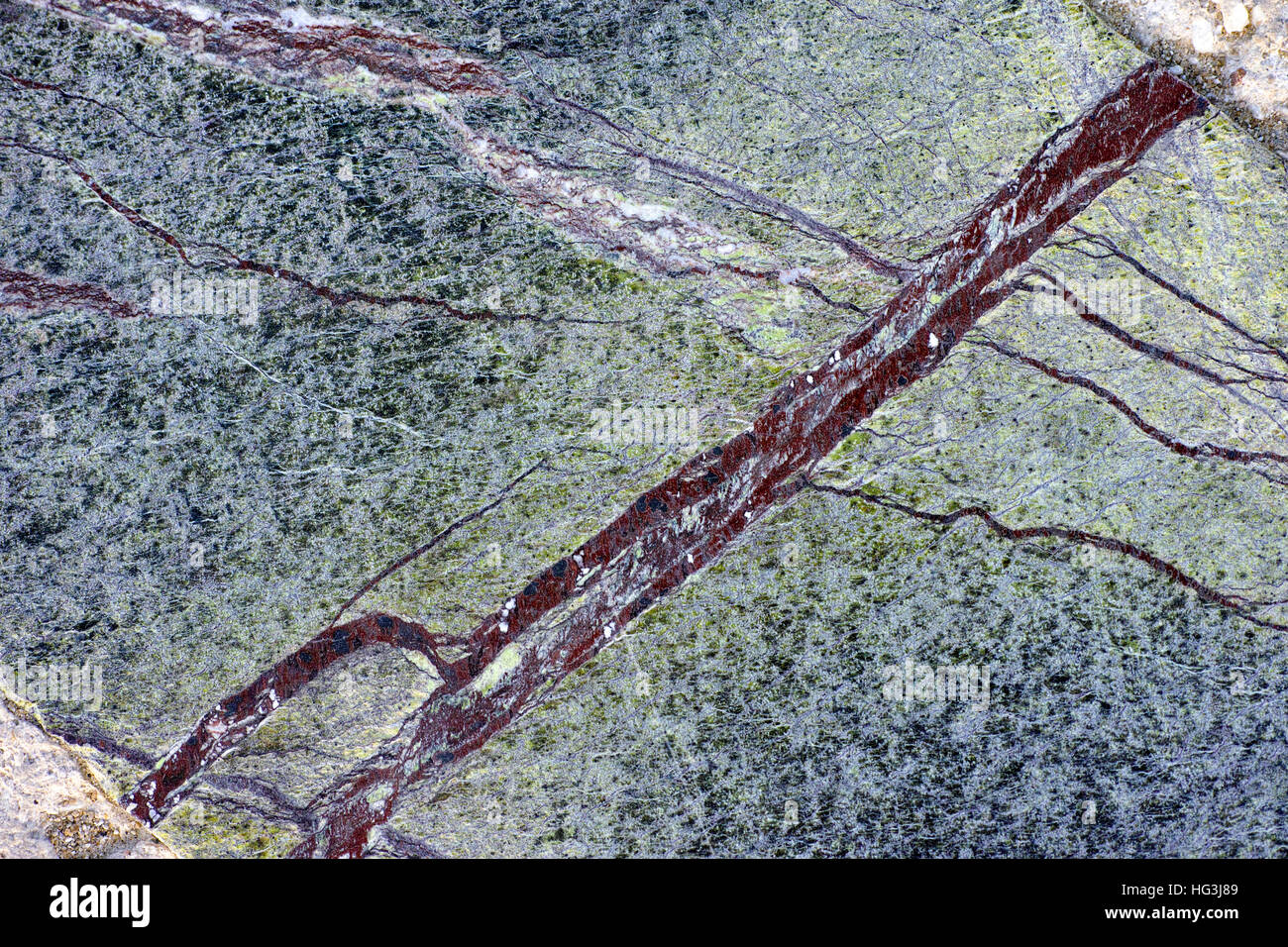 Green marble with dark red lines. Full frame Stock Photo - Alamy