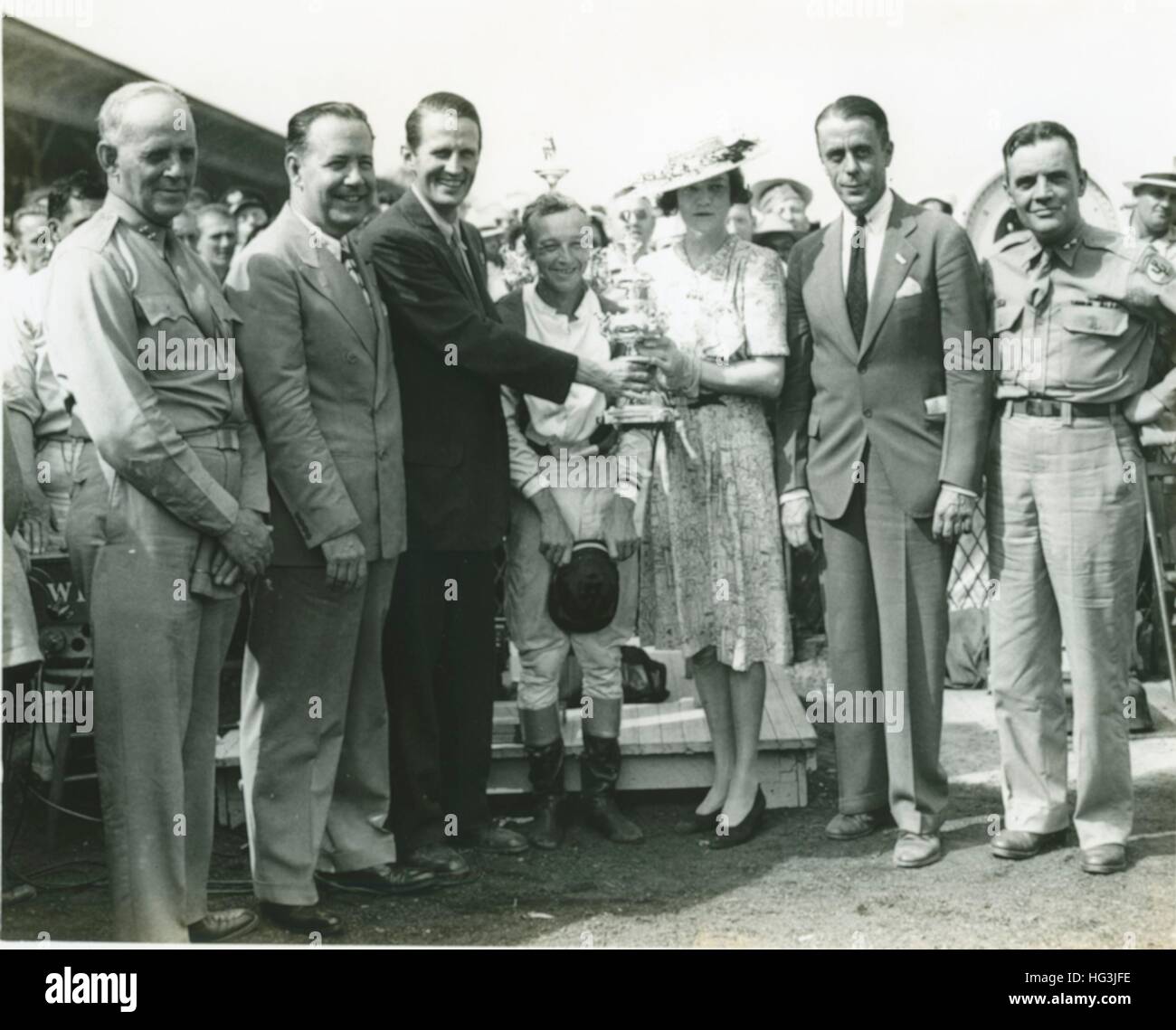 Presentation of Winners Trophy, 1945 Preakness won by Polynesian. L to ...
