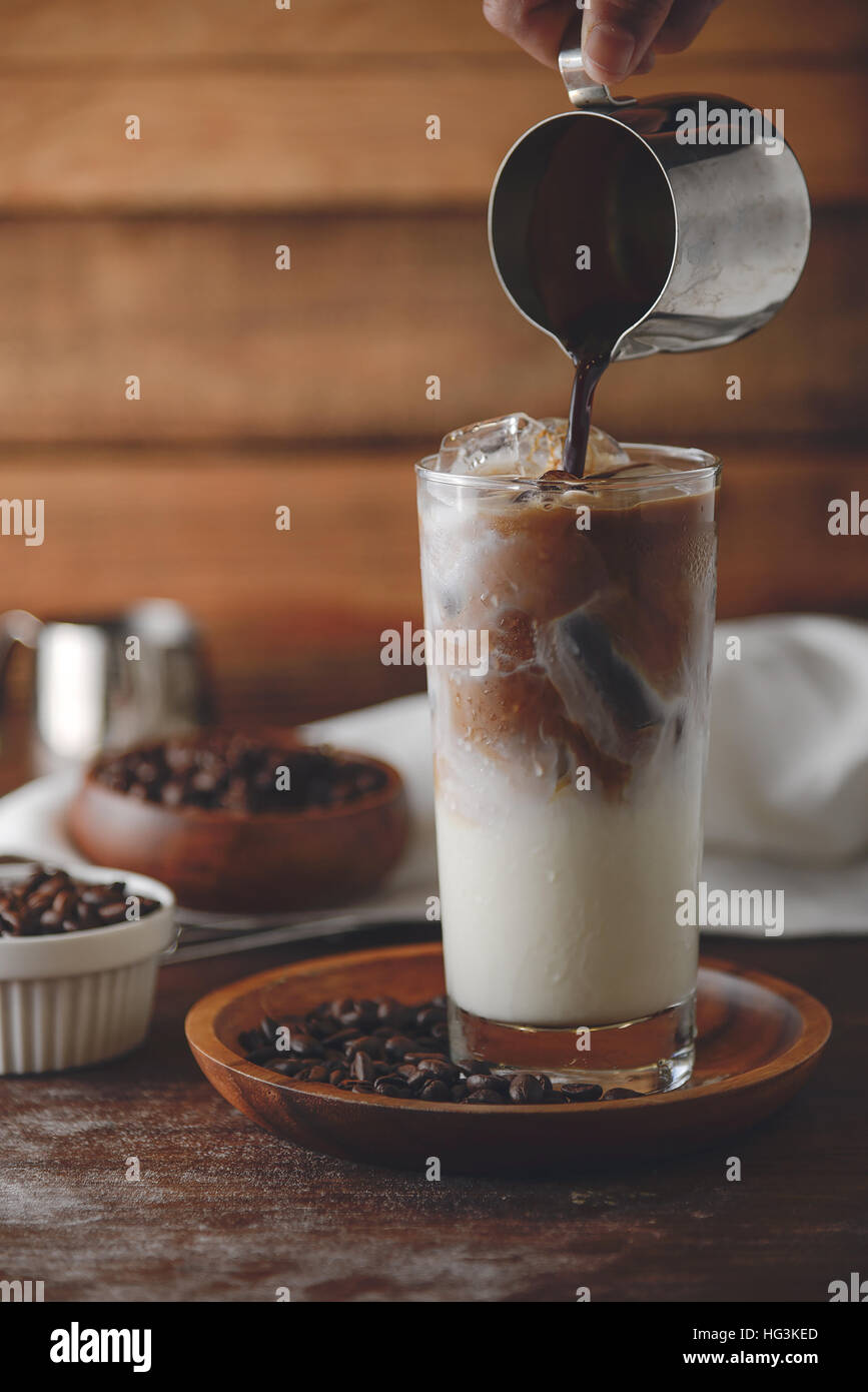 Hand pouring milk coffee hi-res stock photography and images - Alamy
