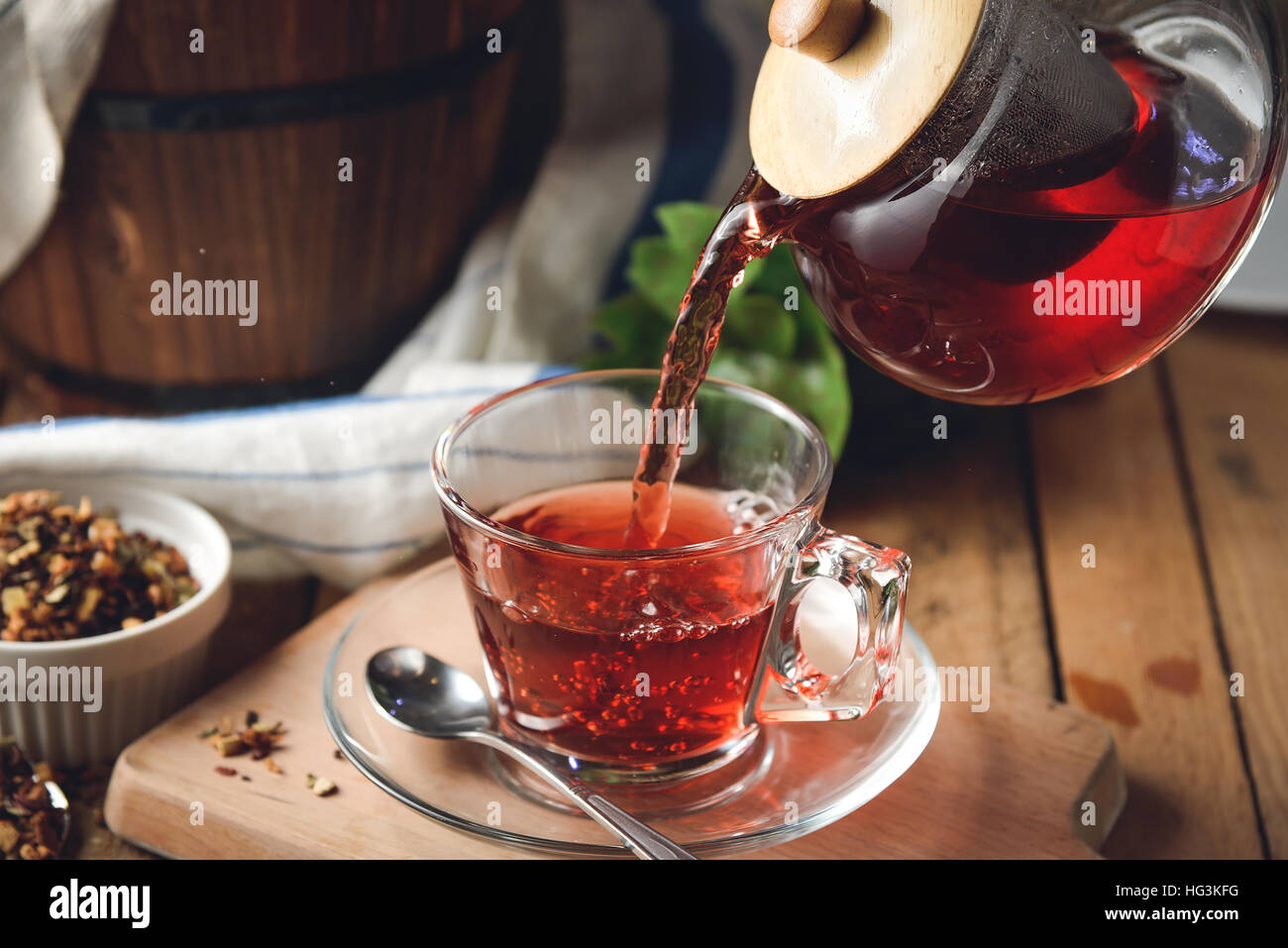 Pouring hot floral tea to a glass Stock Photo - Alamy