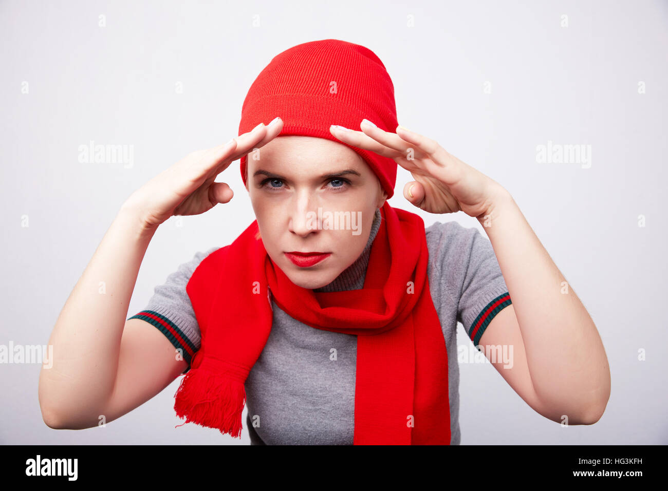 Woman looking through blind scared hi-res stock photography and images ...