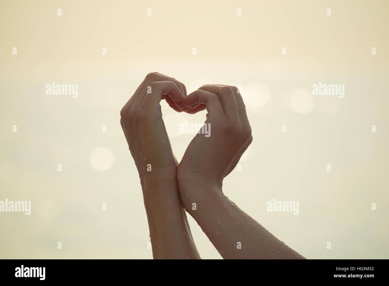 hands folded heart Stock Photo - Alamy